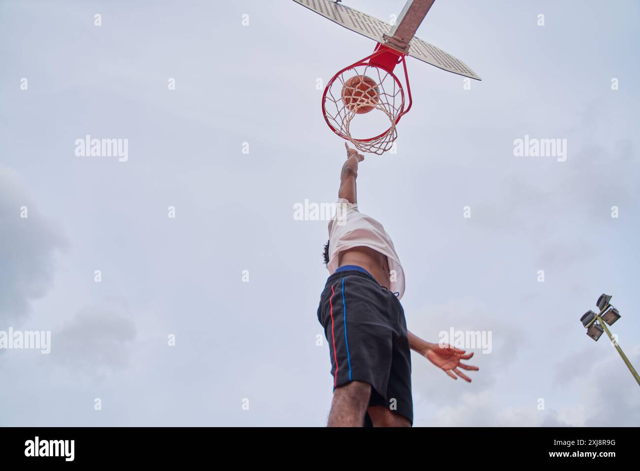 basketball player making slam dunk Stock Photo - Alamy