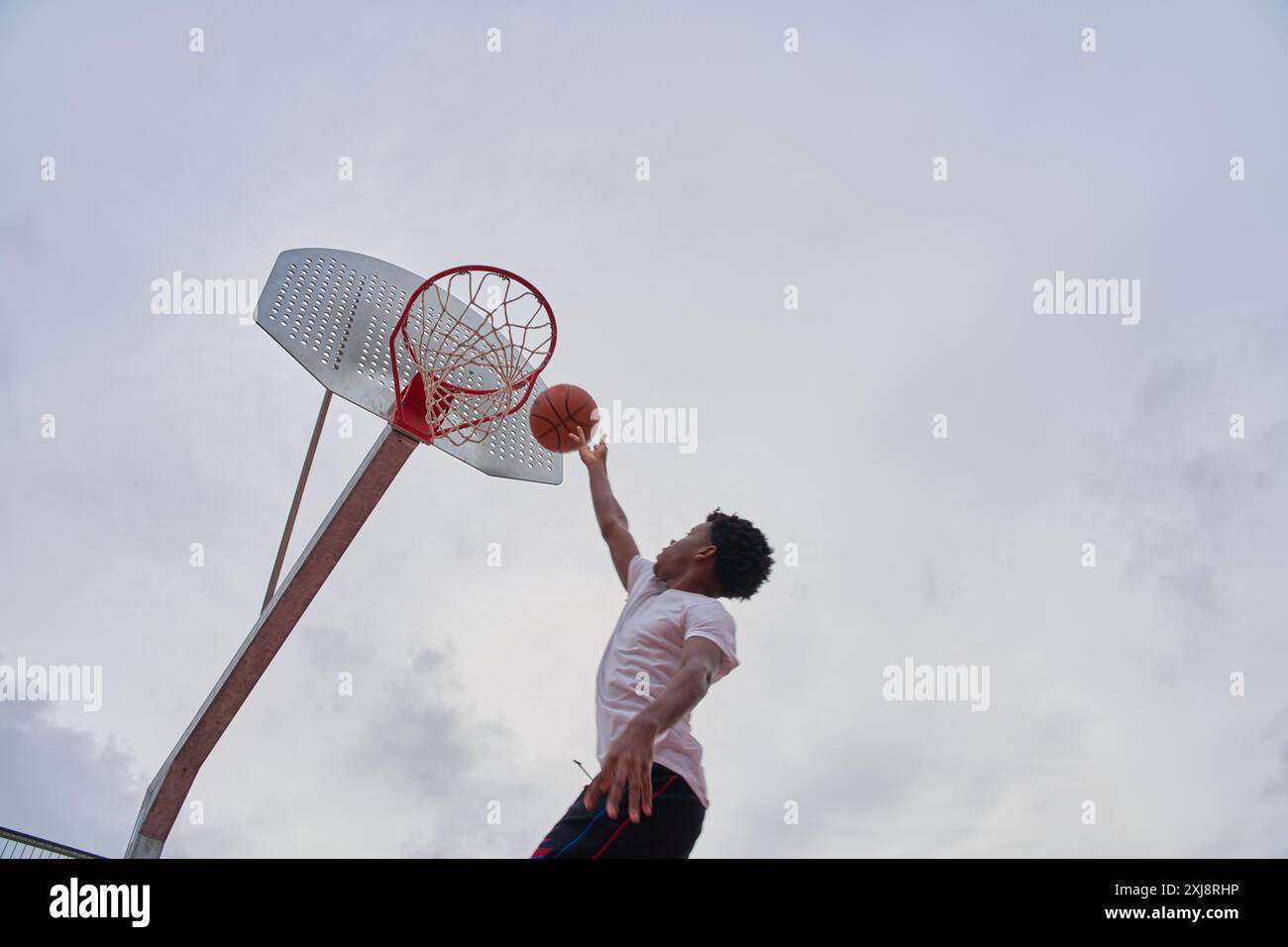 basketball player making slam dunk Stock Photo - Alamy
