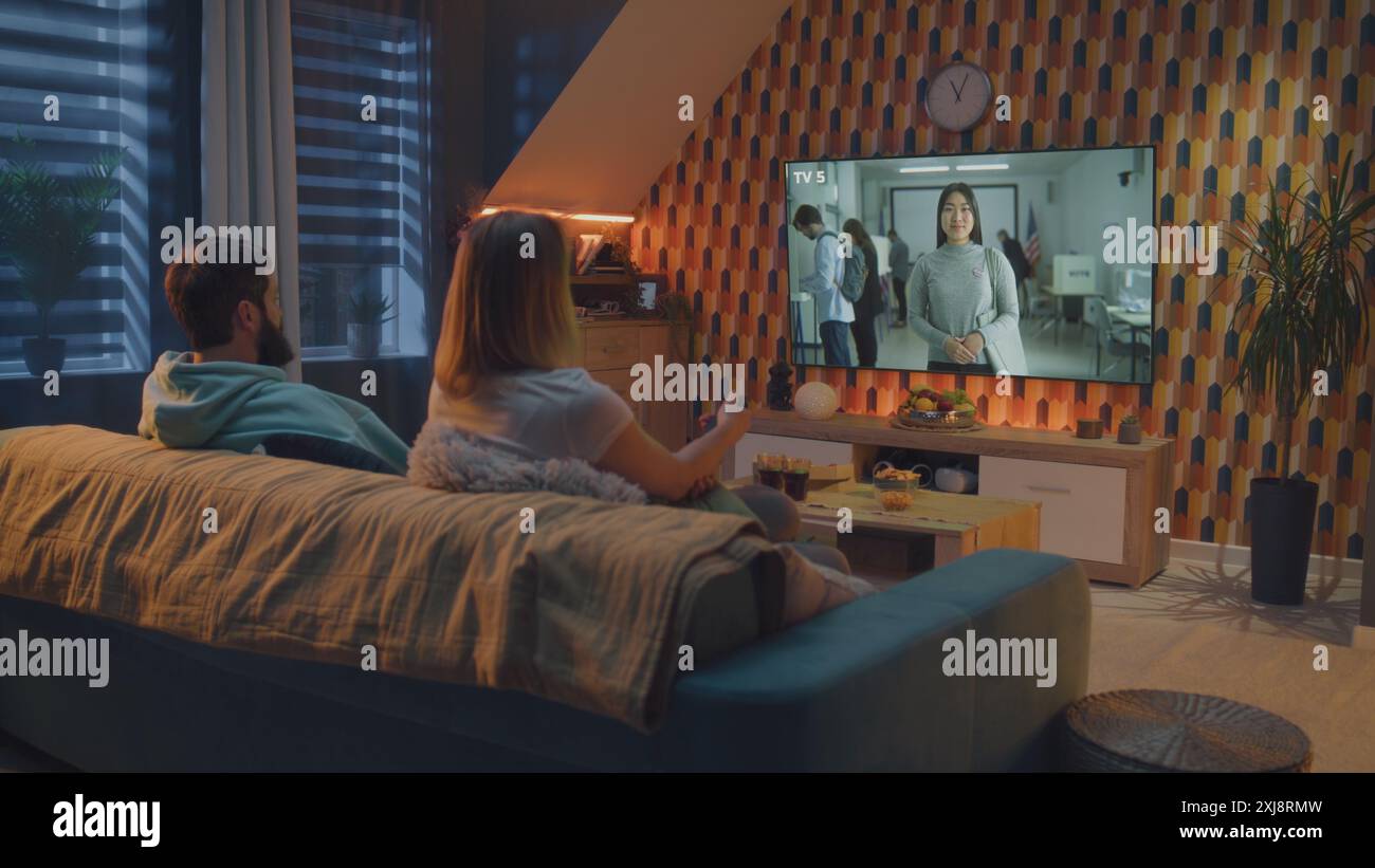 Woman switches tv channels hi-res stock photography and images - Alamy