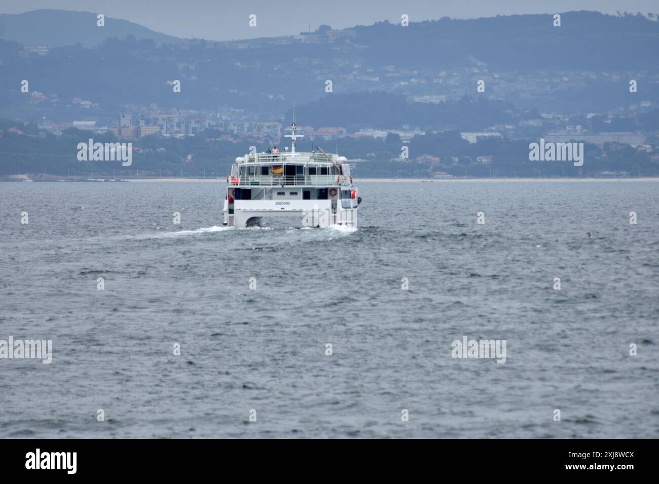 A passenger ferry as it departs from Rodas Port on the stunning Cies ...
