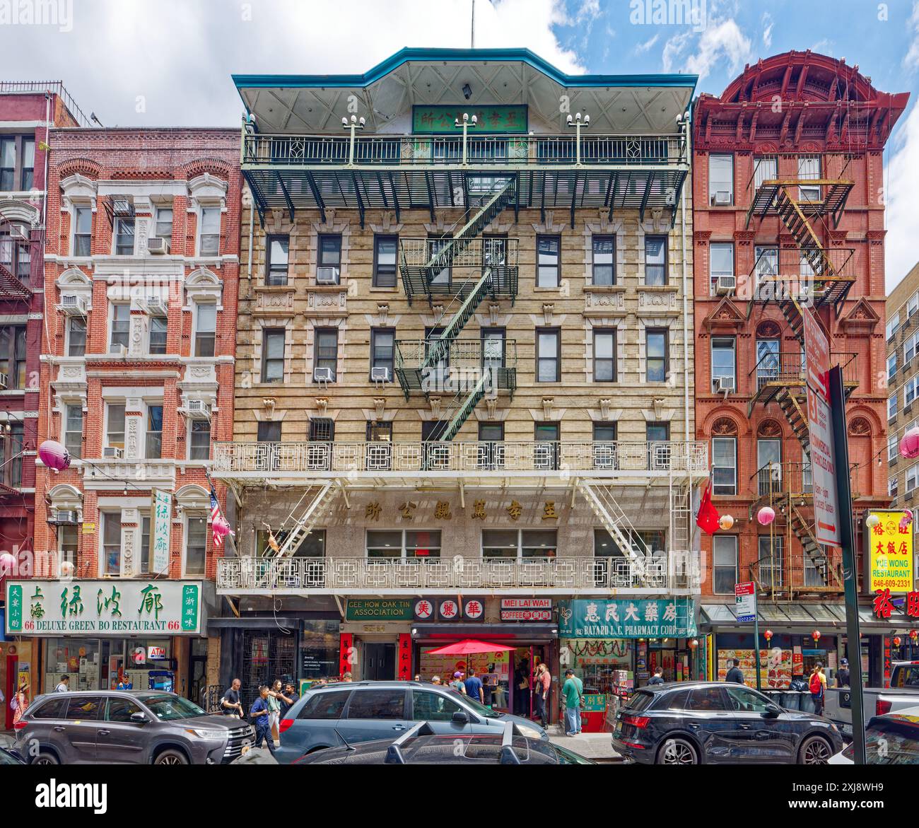 NYC Chinatown: Chinese flags fly at 62-64 Bayard Street, Gee How Oak ...