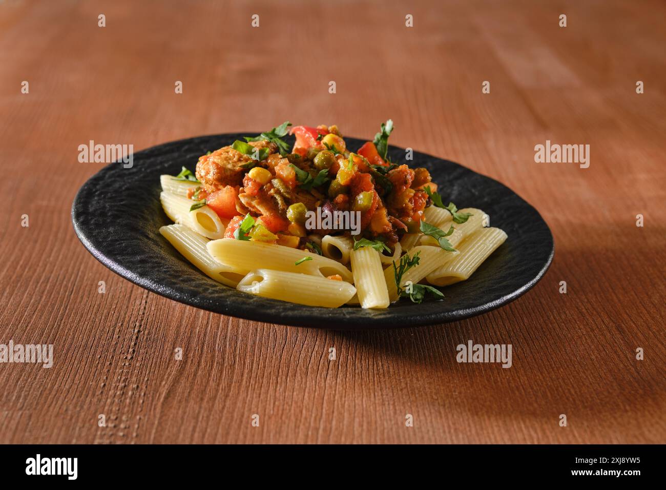 Beef ragout fried with vegetables and spicy sauce with pasta Stock ...