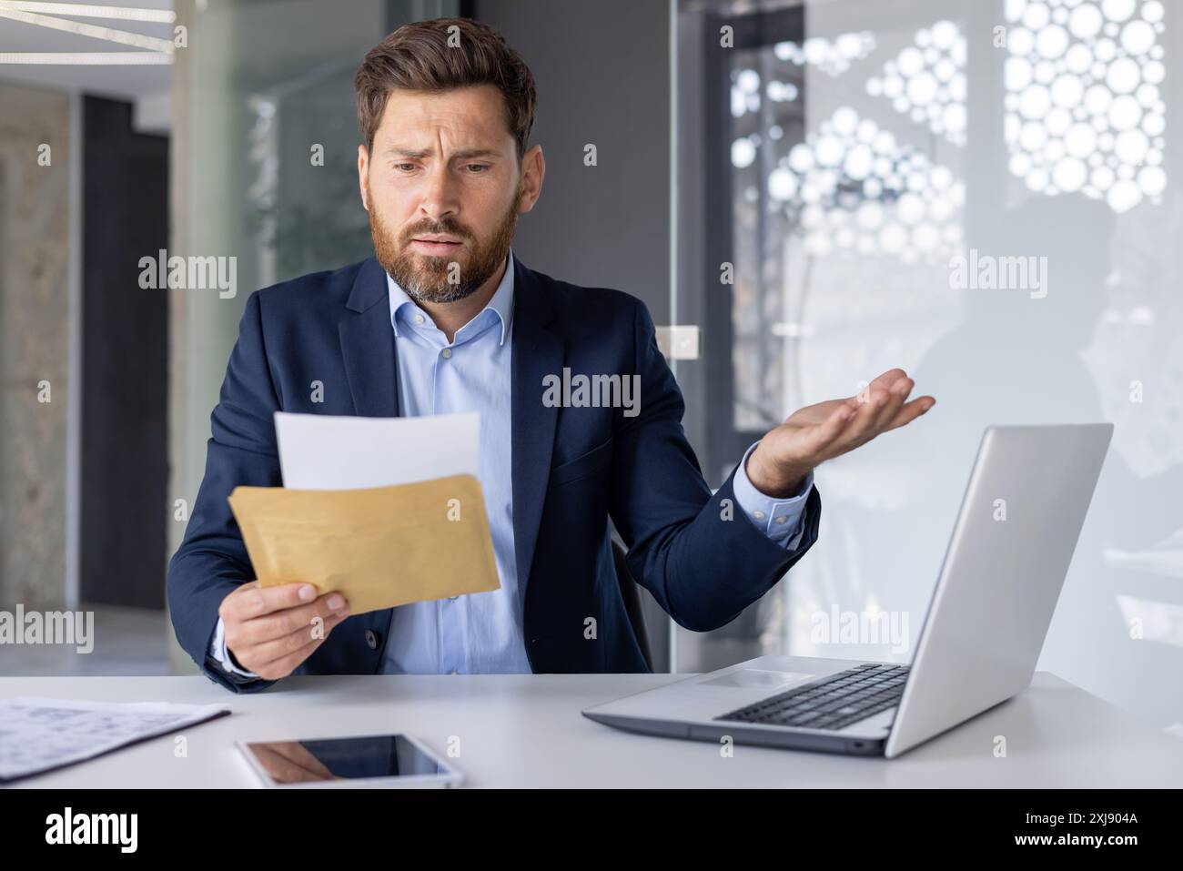 Professional businessman appears confused hi-res stock photography and ...