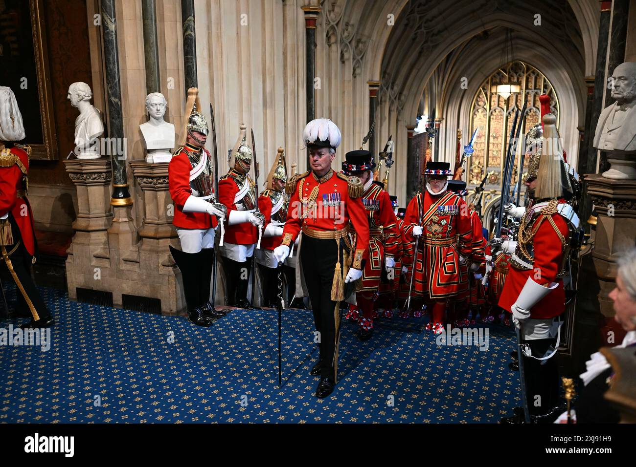 The King's Bodyguard the Yeomen of the Guard make their way through the Norman Porch ahead of ...