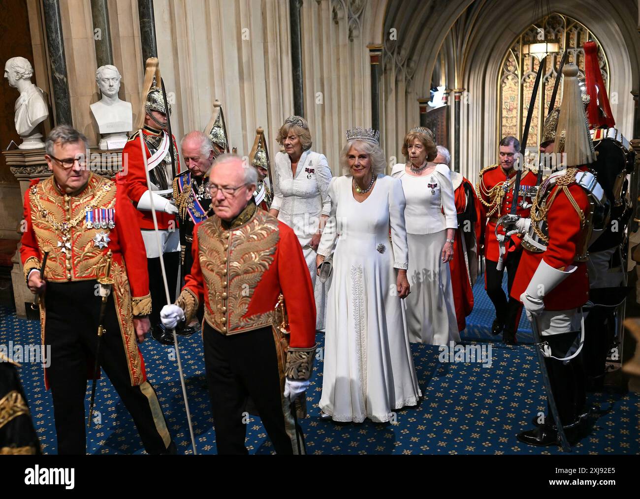 King Charles III and Queen Camilla, followed by the Queen's Companiion ...