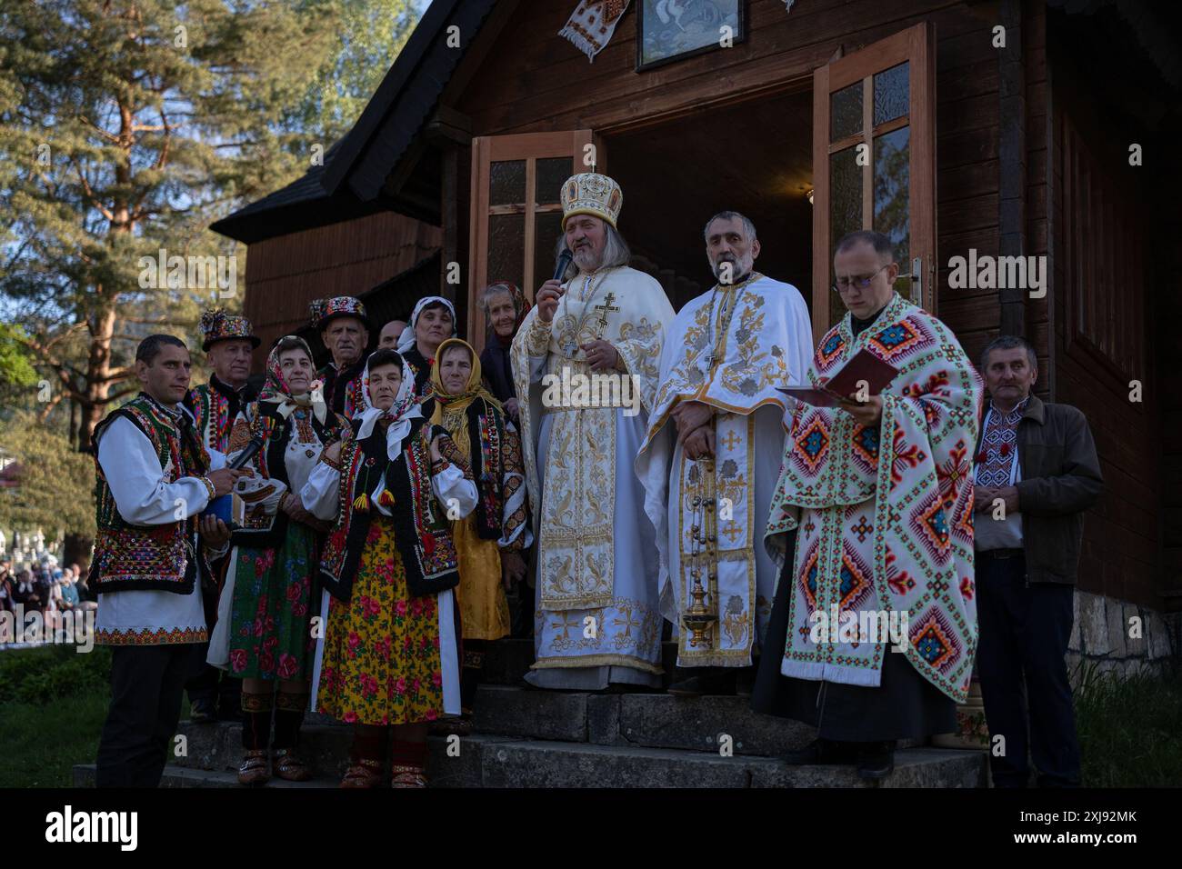 Father Ivan begins the Easter morning mass in Kryvoryvnia. Provody is ...