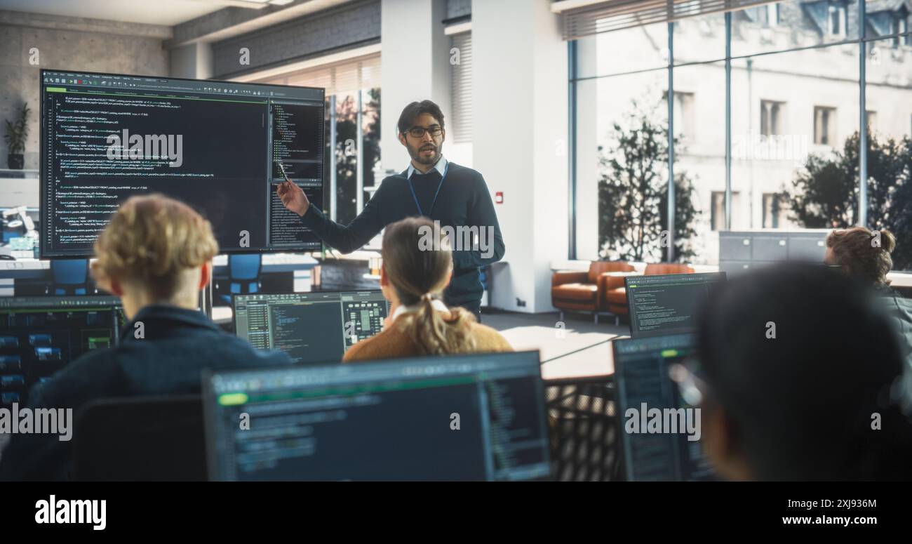 Teacher Giving Computer Science Lecture to Diverse Multiethnic Group of ...