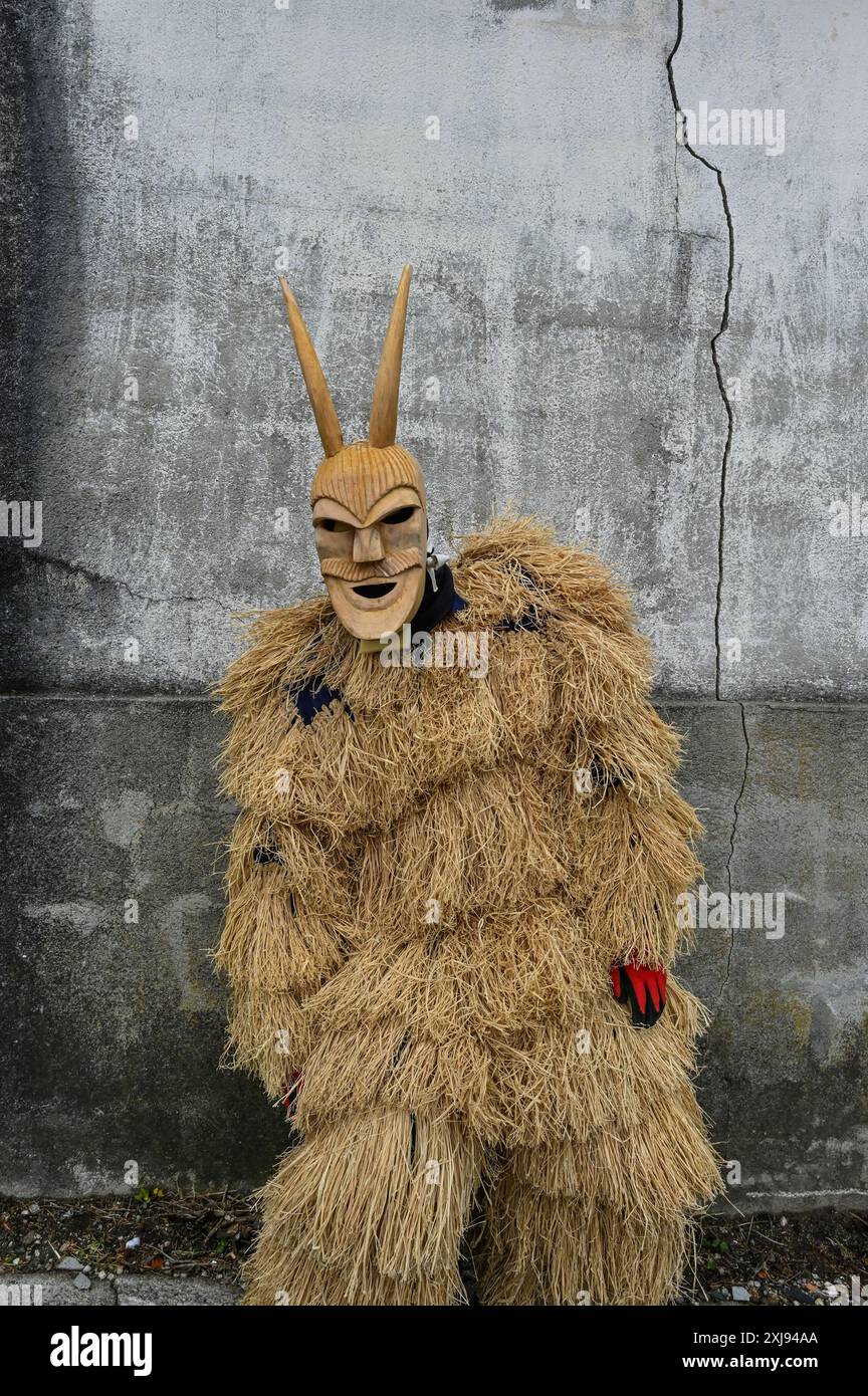 A traditional mask from Lazarim, Portugal, intricately carved from wood ...