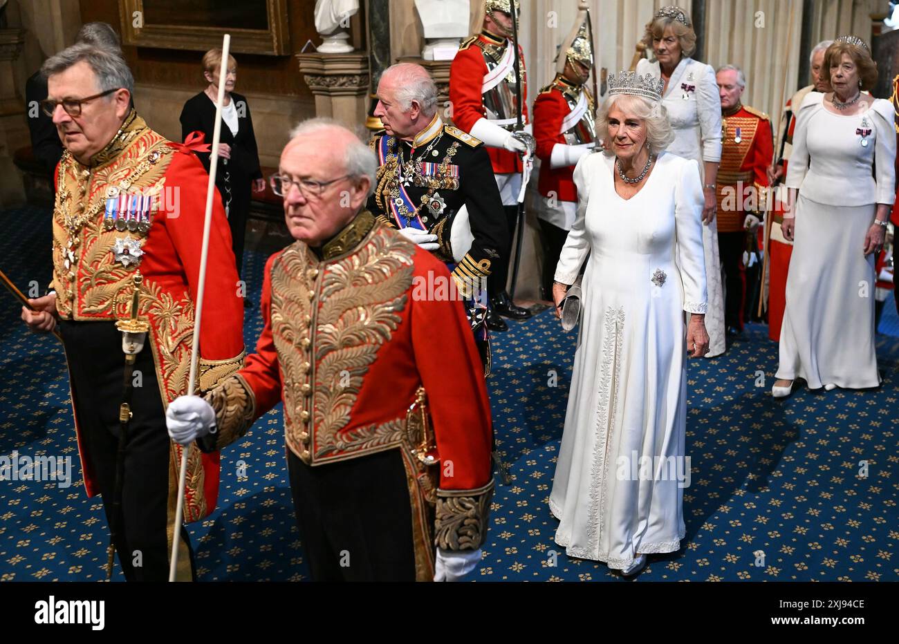 King Charles III and Queen Camilla, followed by the Queen's Companions ...