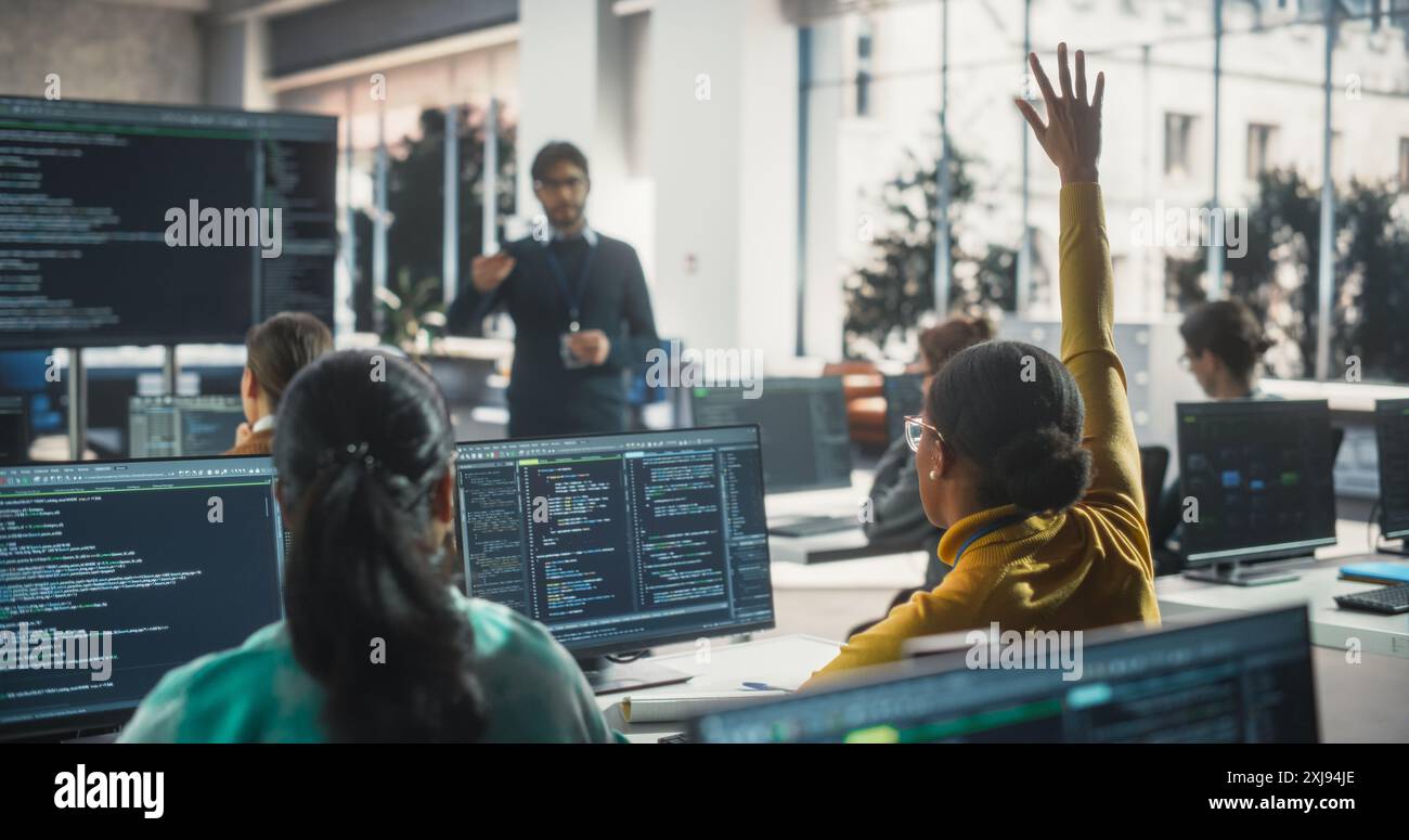 Teacher Giving Computer Science Lecture to Diverse Multiethnic Group of ...