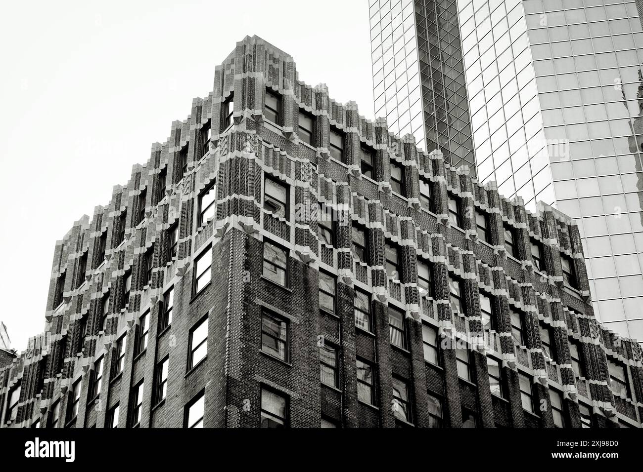 Neo-Gothic crown details of a brick skyscraper with fluted brick window ...