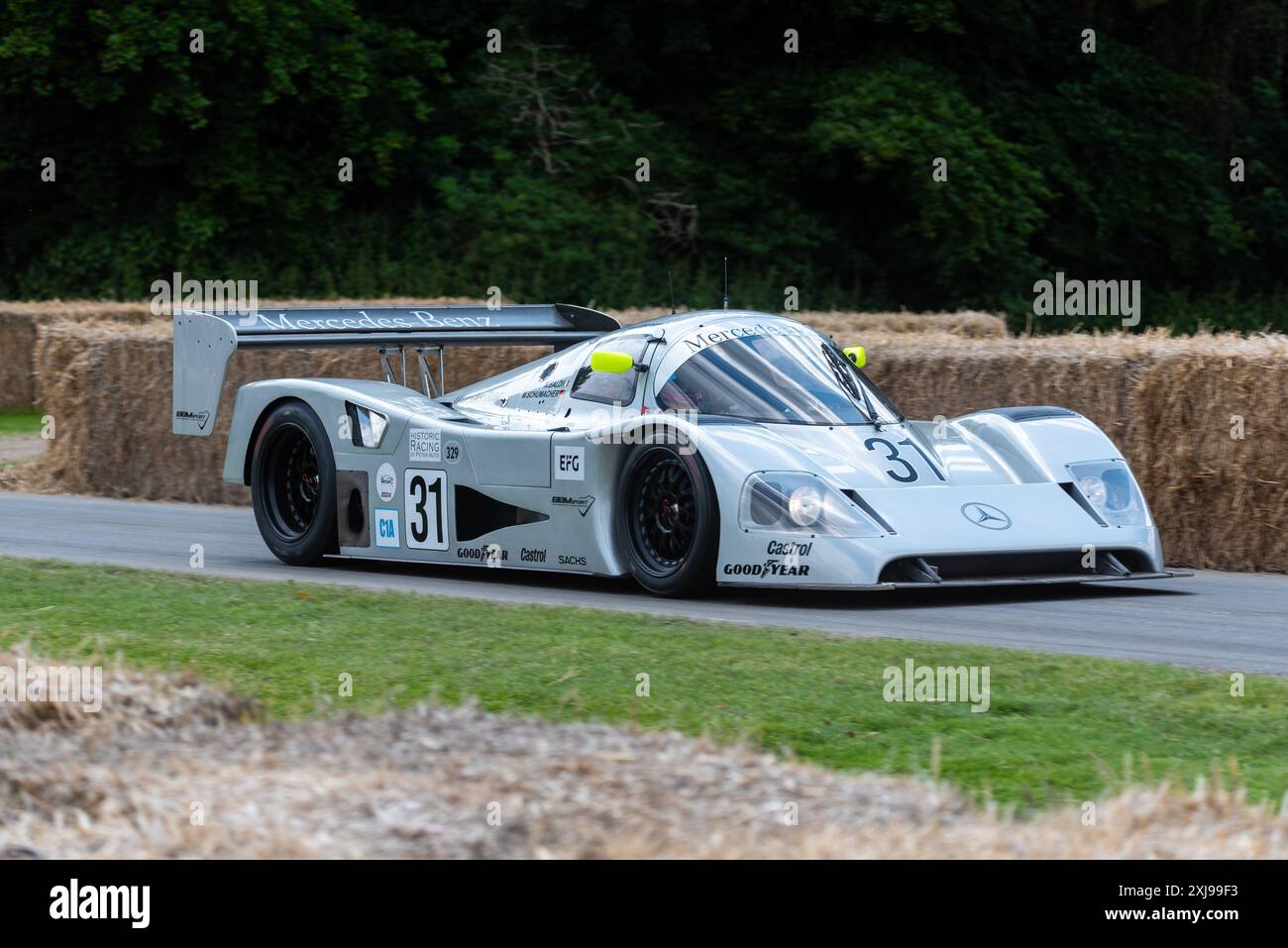 1990 Mercedes-Benz C11 race car driving up the hill climb track at the ...