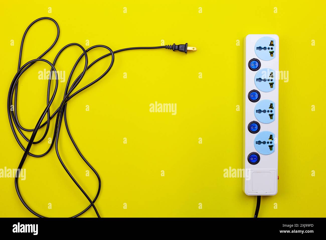 Electric power socket and plug on yellow paper background Stock Photo ...