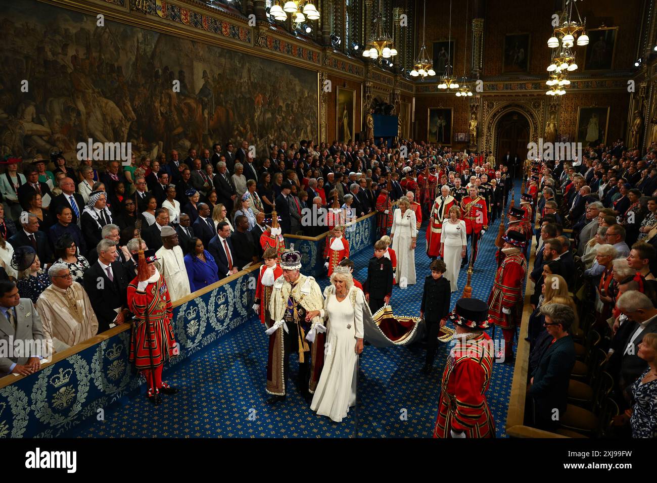 King Charles III, wearing the Imperial State Crown and the Robe of ...