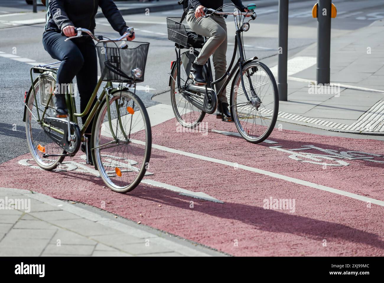 Female cyclists side by side on a two-lane cycle path Stock Photo - Alamy