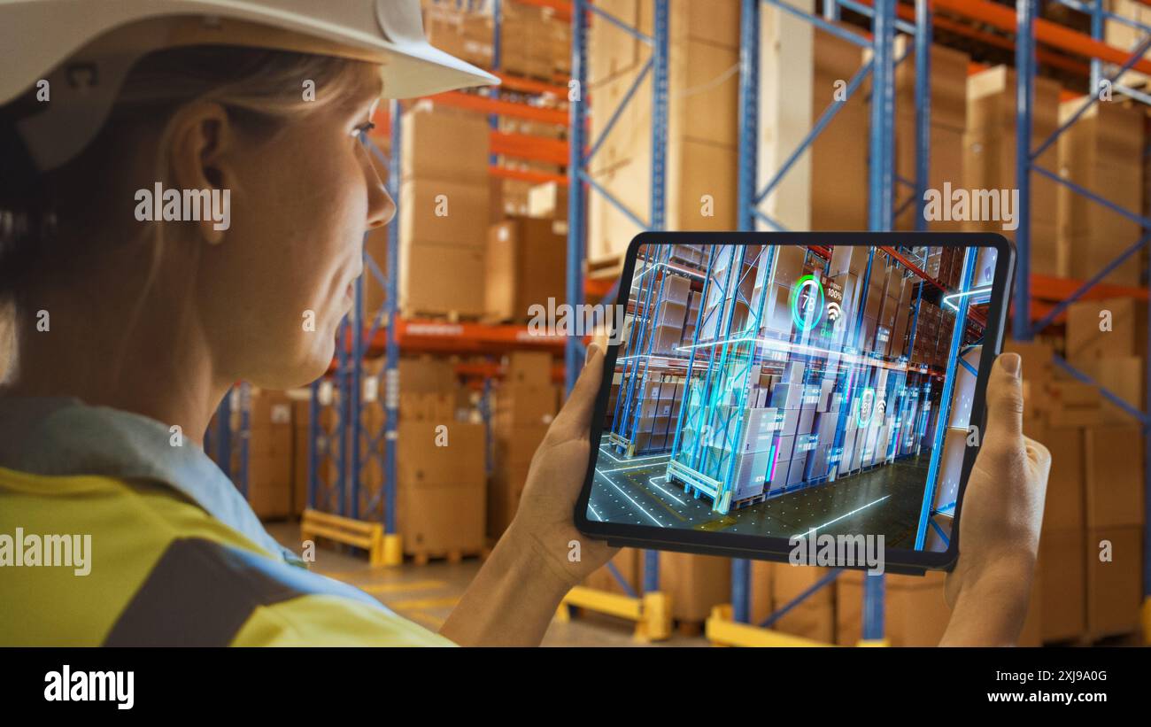 Futuristic Technology Warehouse: Female Worker Doing Inventory, Using ...