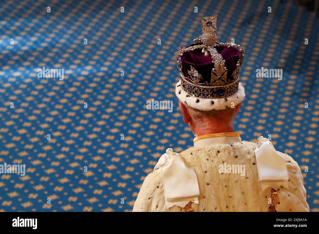 King Charles III, wearing the Imperial State Crown and the Robe of ...
