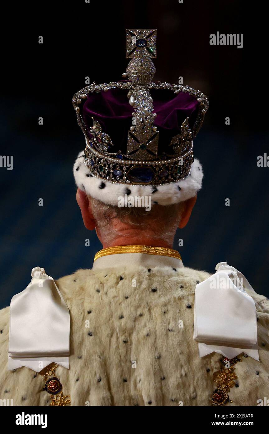 King Charles III, wearing the Imperial State Crown and the Robe of ...