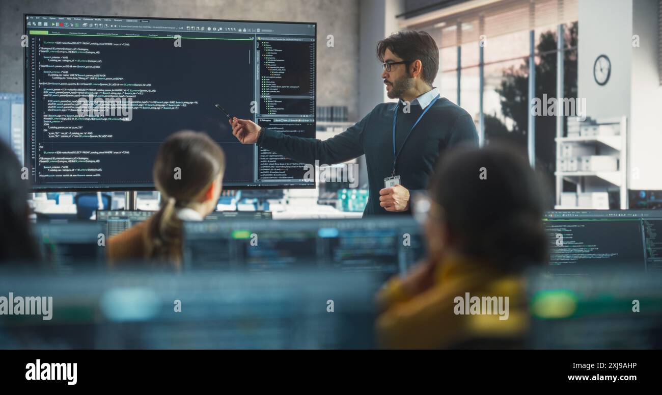 Teacher Giving Computer Science Lecture to Diverse Multiethnic Group of ...