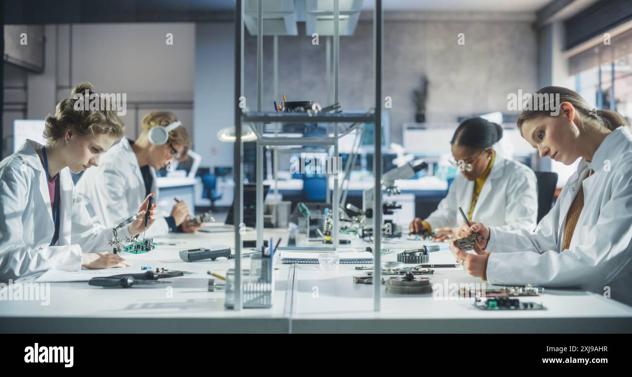 High School Science Classroom: Diverse Multiethnic Group of Students Experimenting with Computer ...