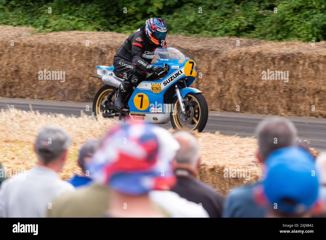 1975 Suzuki RG500 XR14 motorcycle riding up the hill climb track at the ...