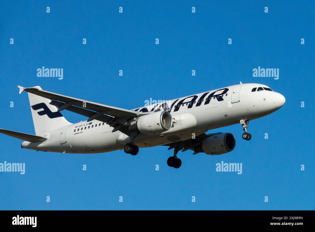Airbus A320 Finnair Airways Plane Landing in blue sky Stock Photo - Alamy