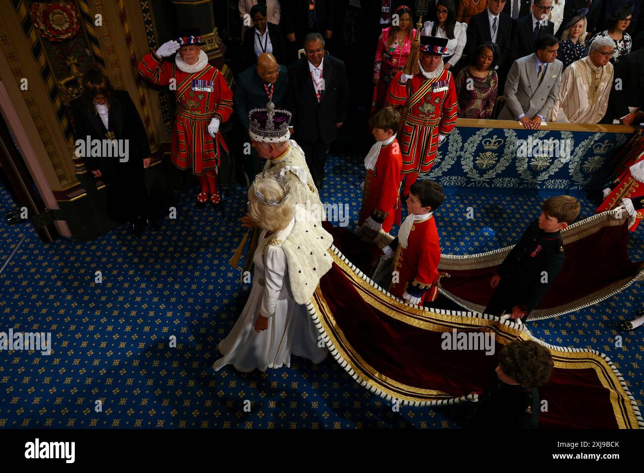 King Charles III, wearing the Imperial State Crown and the Robe of ...