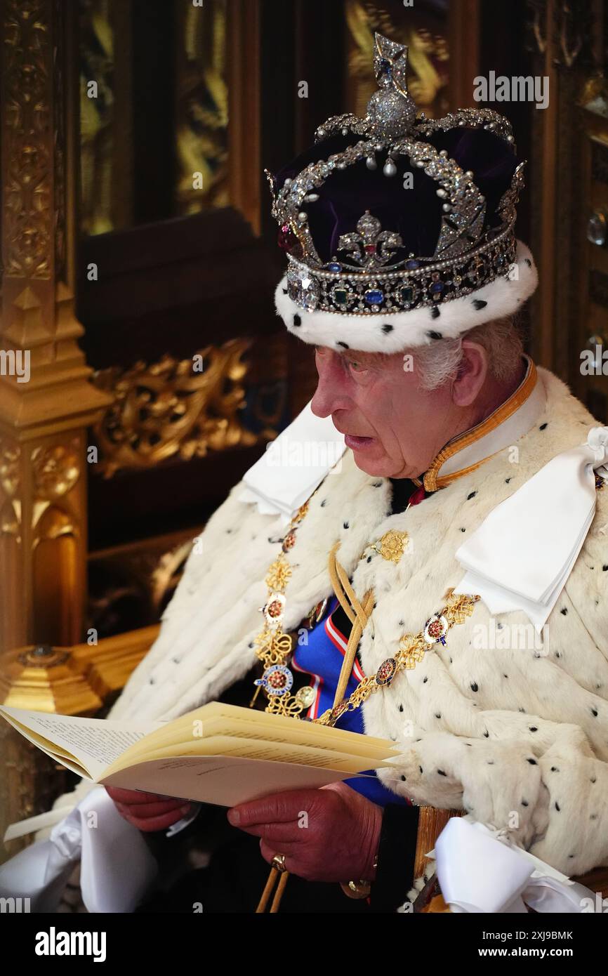 King Charles III, wearing the Imperial State Crown and Robe of State ...