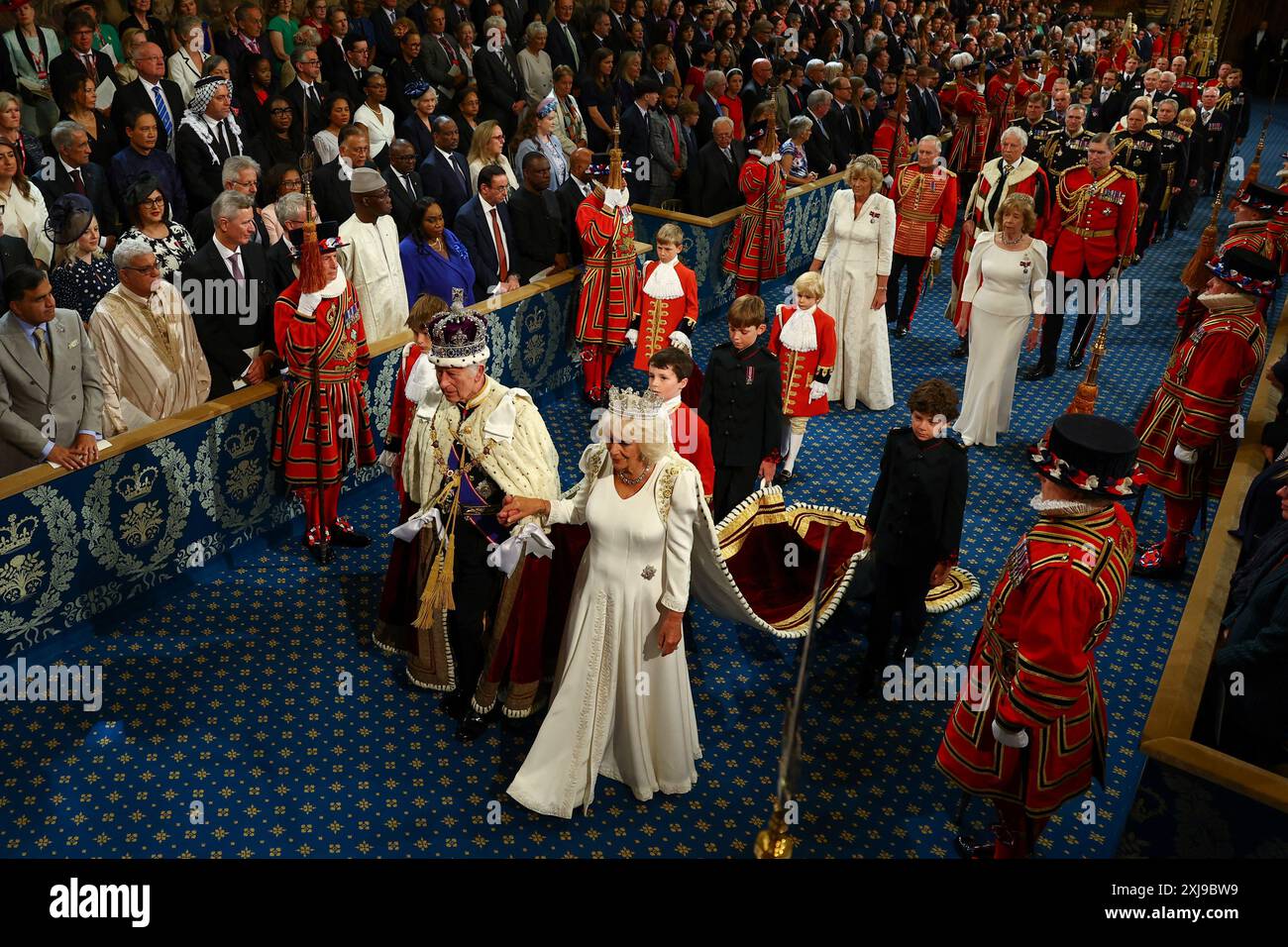 King Charles III, wearing the Imperial State Crown and the Robe of ...