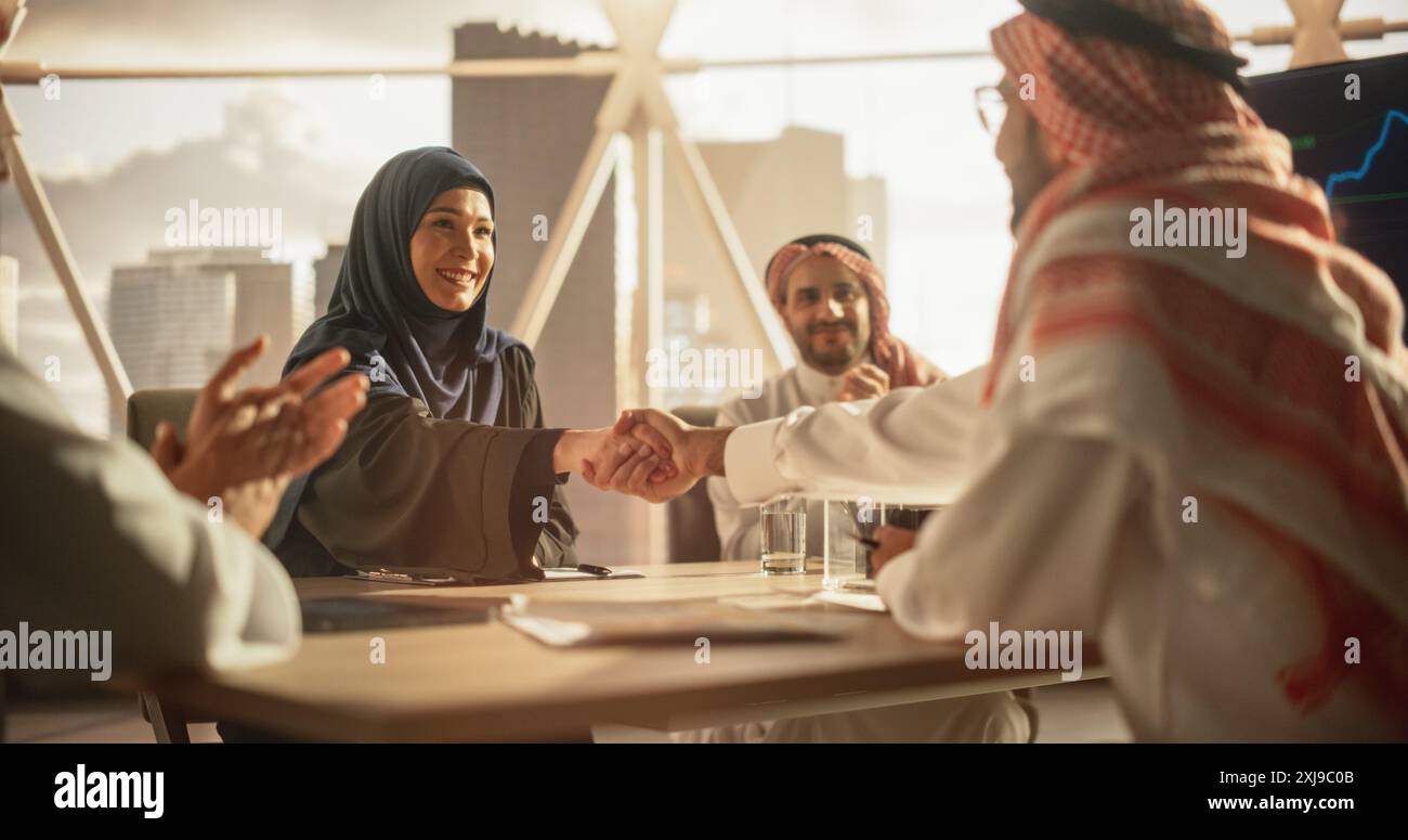 Muslim Businesspeople Closing a Business Deal at a Corporate Modern ...