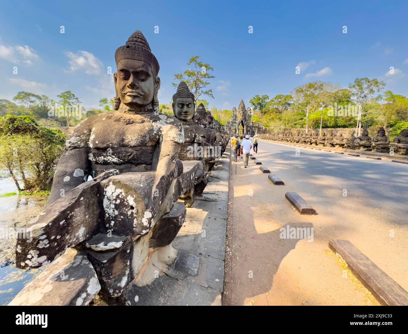 The bridge to Angkor Thom, lined on both sides with figurines ending in ...