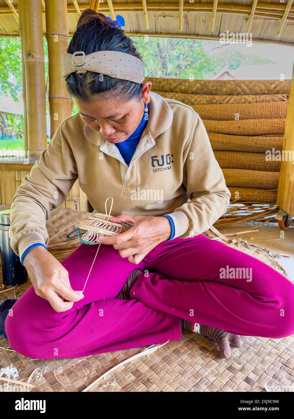 Craftsman working on various projects at the Satcha Handicraft Center ...