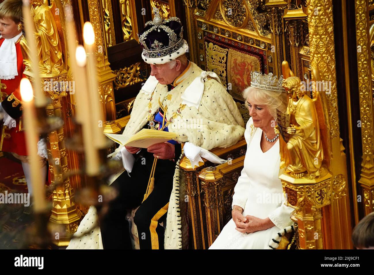 King Charles III, wearing the Imperial State Crown and the Robe of ...