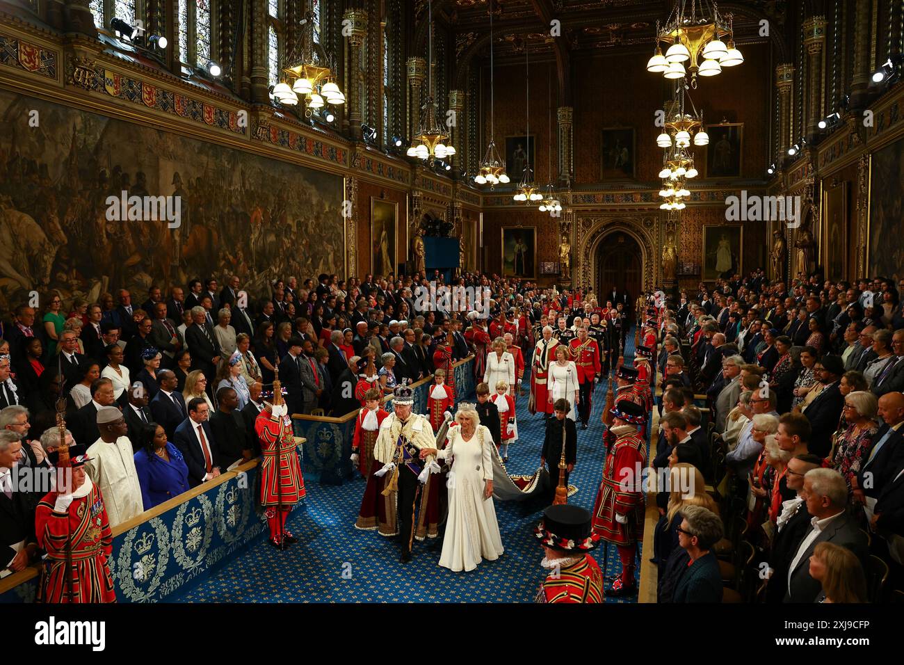 King Charles III, wearing the Imperial State Crown and the Robe of ...