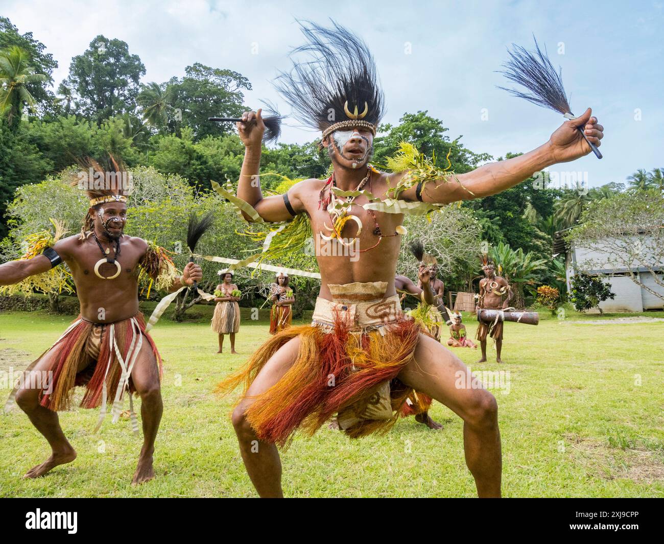 Six different groups of native warriors, drummers, and dancers perform on Kwato Island, Papua ...