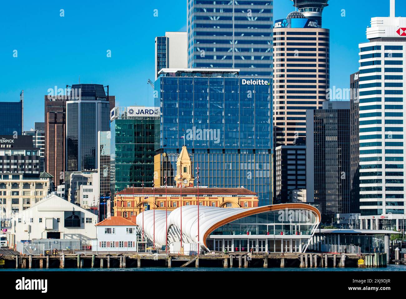 A view of the Auckland waterfront and skyline from the water, showing ...