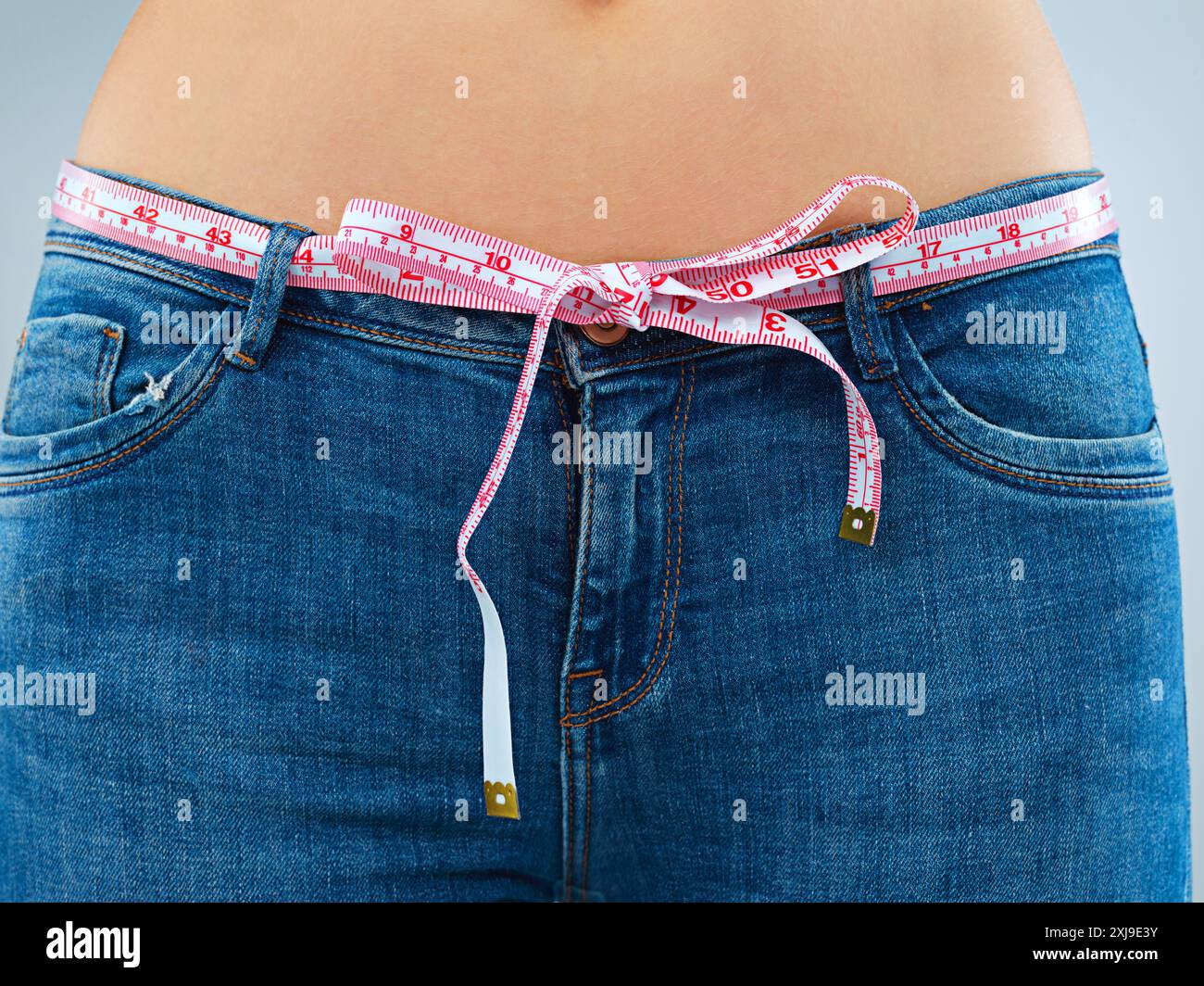 Stomach, weight loss and woman with tape, progress and health goals on ...