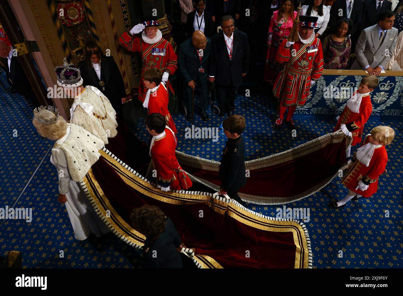 King Charles III, wearing the Imperial State Crown and the Robe of ...