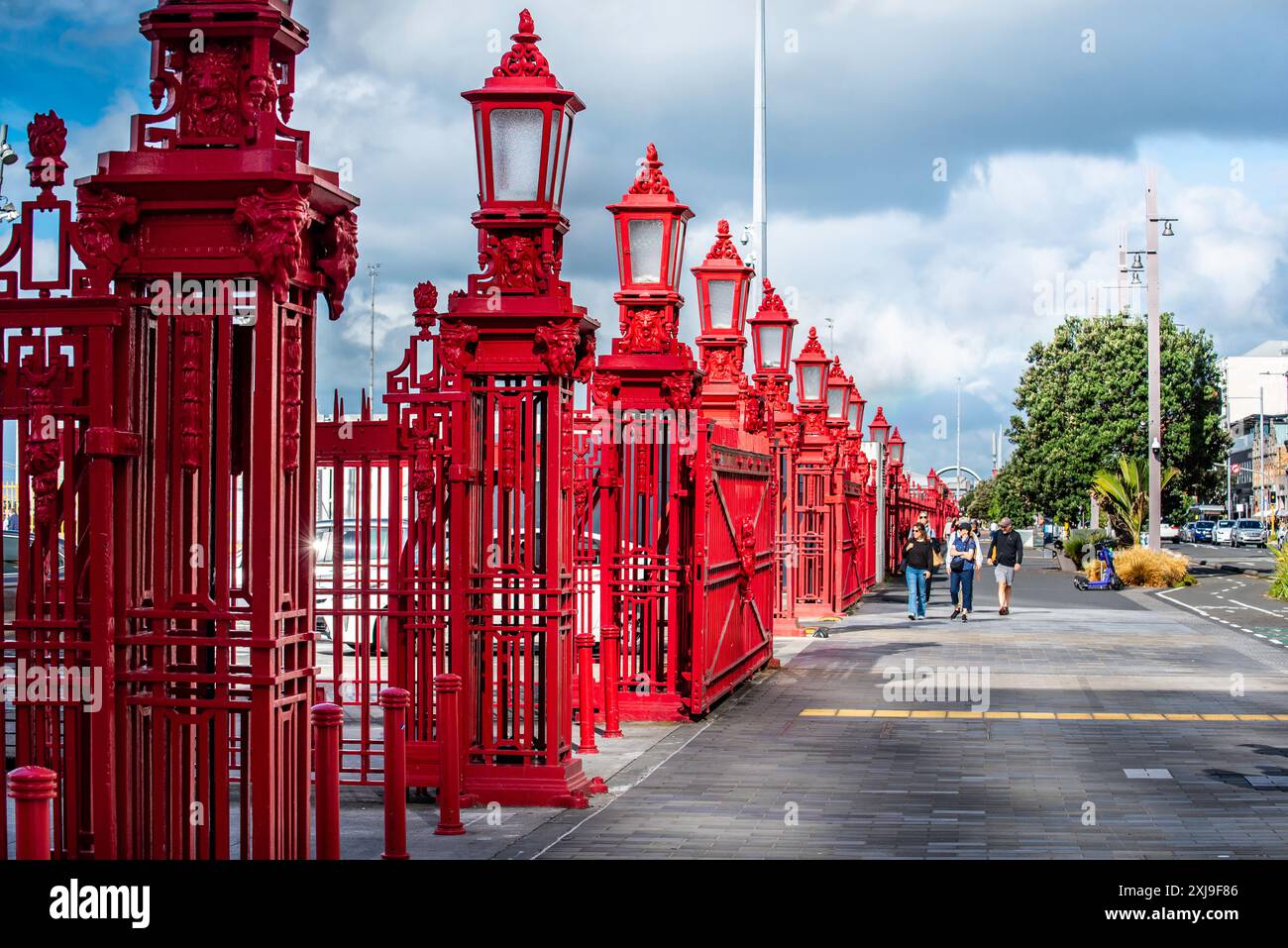 The red paint fences along Auckland Harbour are a functional barrier ...