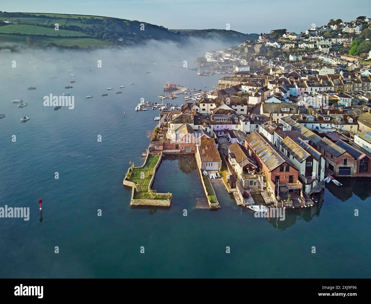 A misty early morning view of the town of Salcombe beside the ...