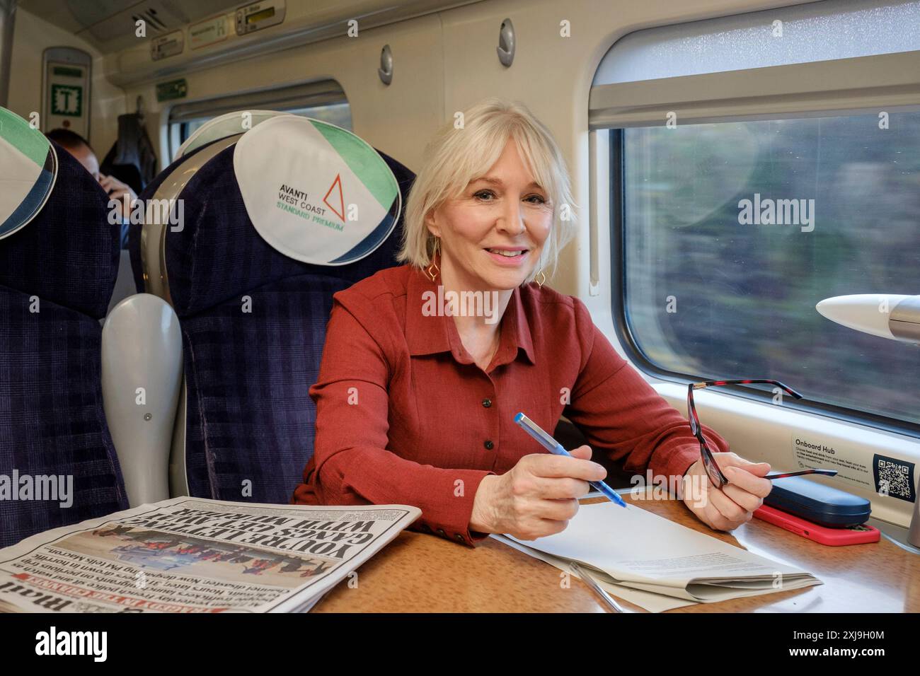 Nadine Dorries Conservative MP until 2023 pictured on a train to her hometown of Liverpool Stock ...