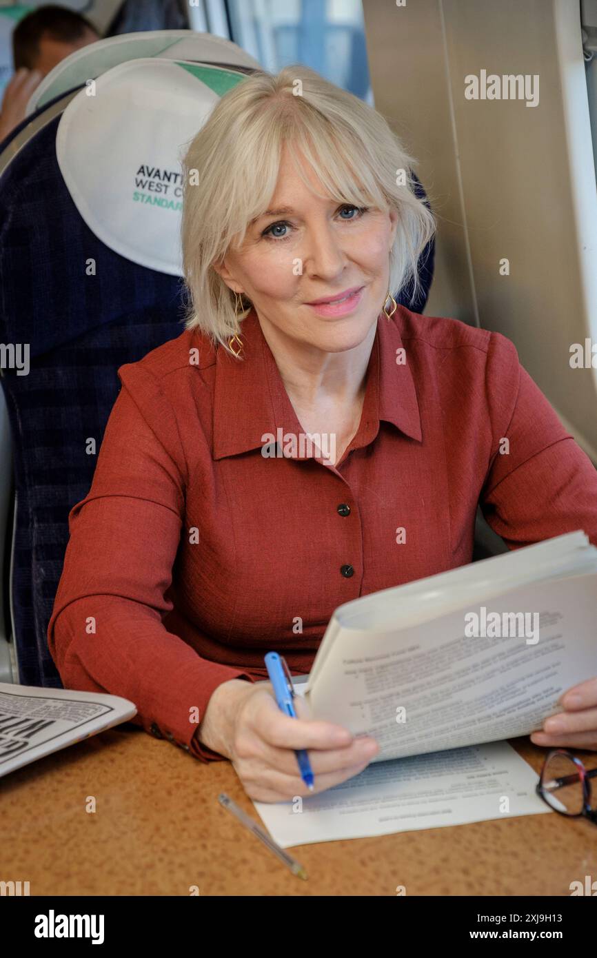 Nadine Dorries Conservative MP until 2023 pictured on a train to her hometown of Liverpool Stock ...