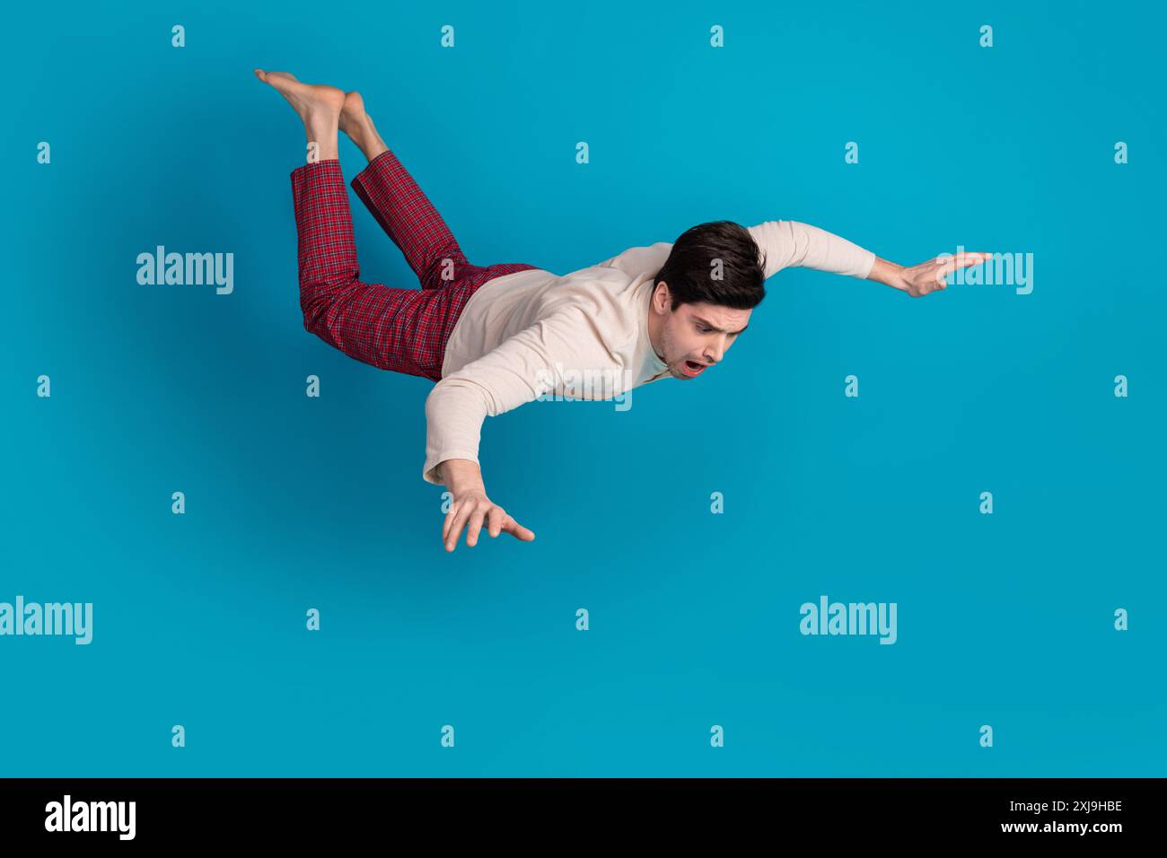 Full length photo of handsome young guy falling down nervous dressed ...