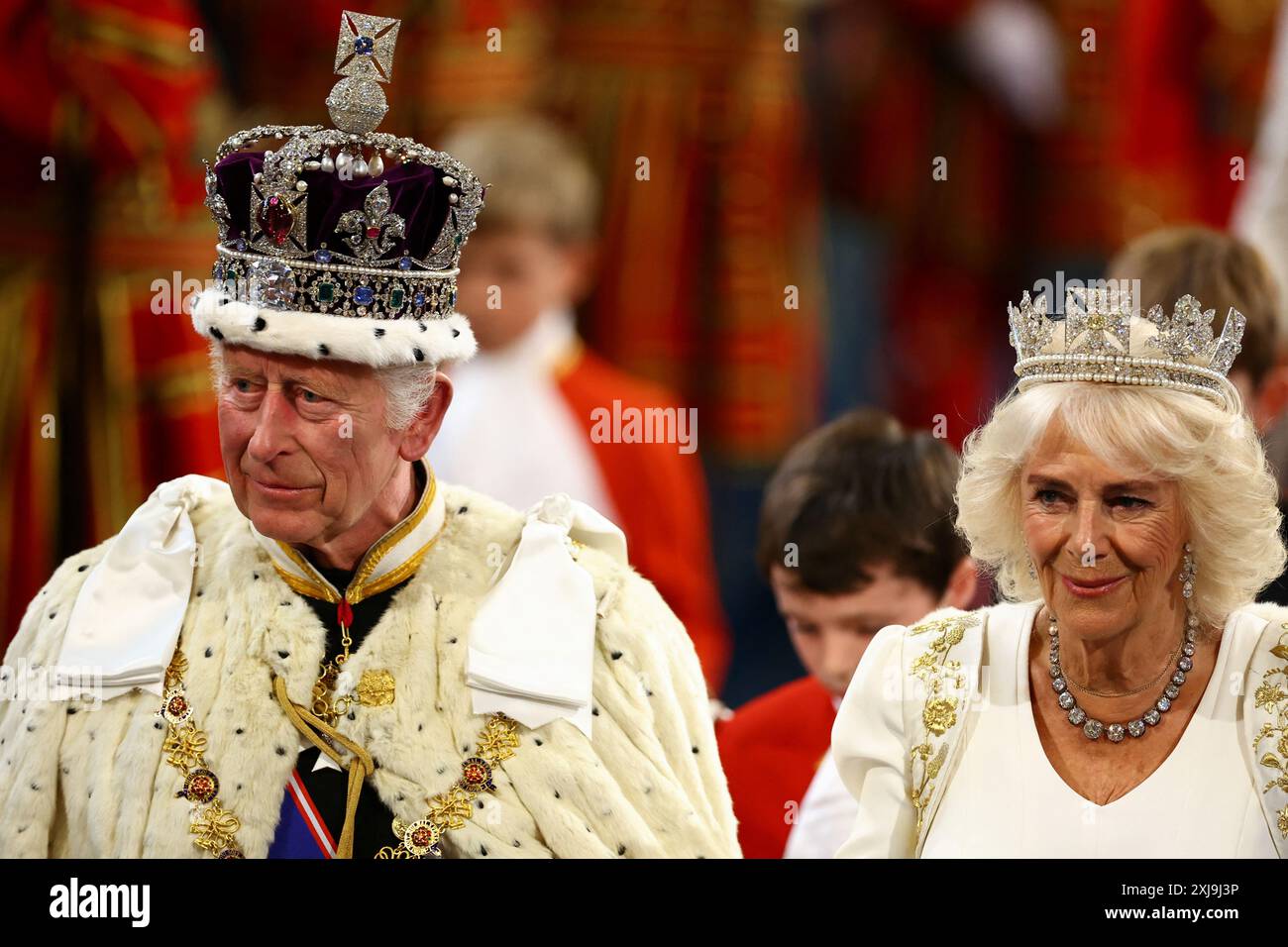 King Charles III, wearing the Imperial State Crown and the Robe of ...