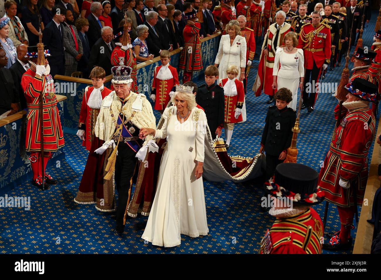 King Charles III, wearing the Imperial State Crown and the Robe of ...