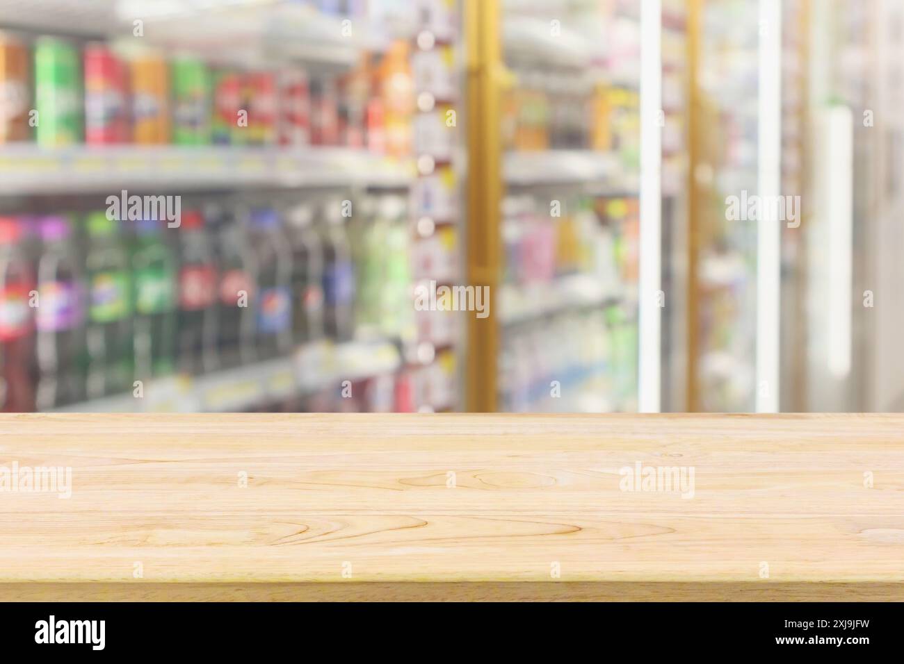 Wood table top with Beverage soft drink bottles in convenience store ...