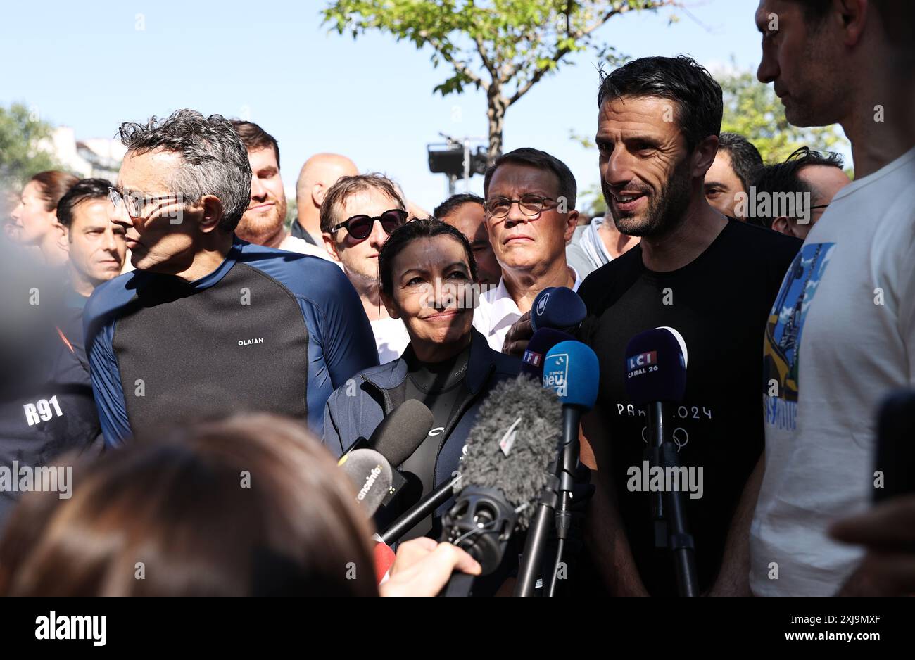 Paris, France. 17th July, 2024. Mayor of Paris Anne Hidalgo (C) and ...