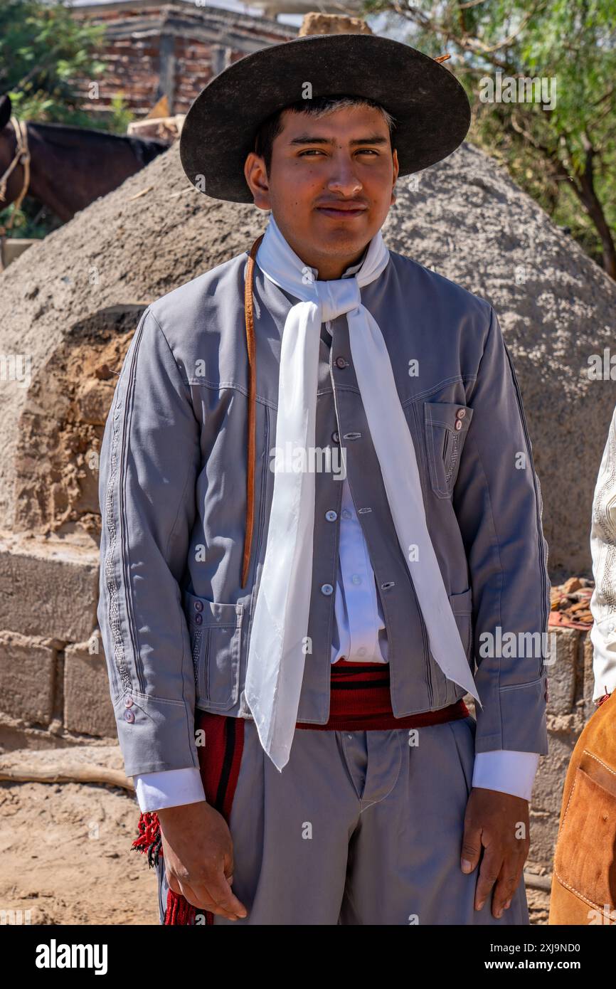 A young gaucho in his traditional outfit, including the bombacha ...