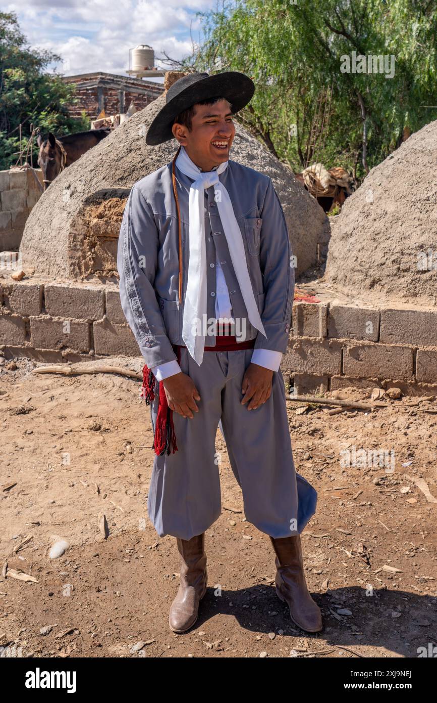 A young gaucho in his traditional outfit, including the bombacha ...