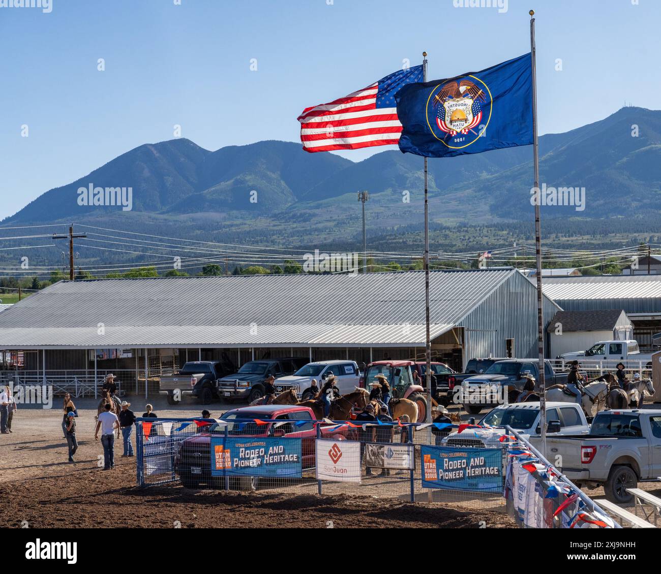 The flags of the state of Utah and the United States fly over the rodeo ...